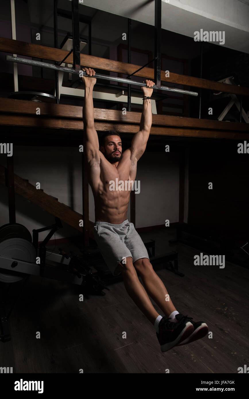 Model Performing Hanging Leg Raises Exercise - One Of The Most ...
