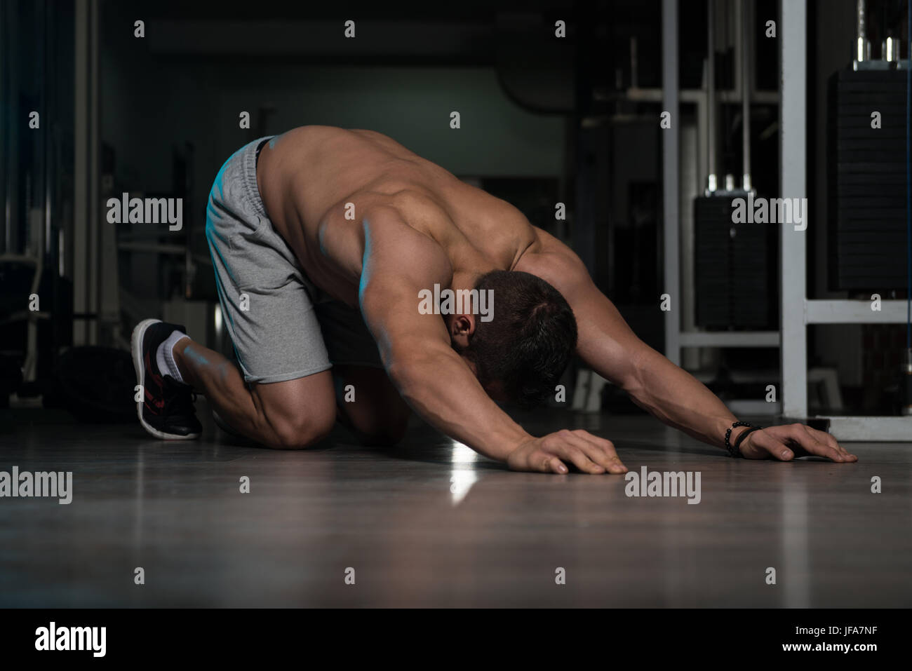Muscular man sitting on floor hi-res stock photography and images - Alamy