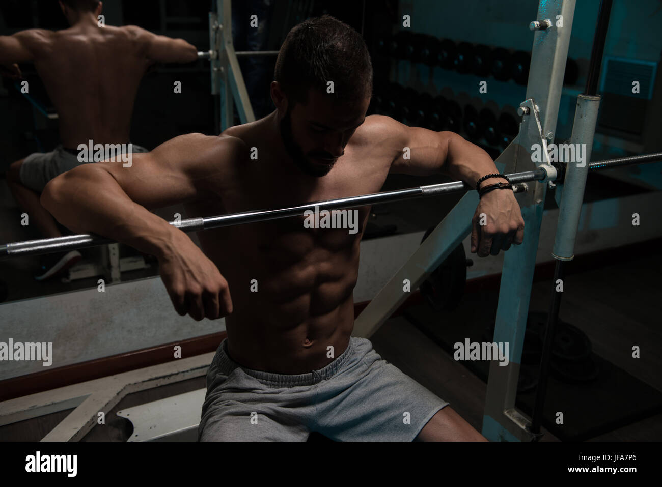 Attractive bodybuilder sitting on bench hi-res stock photography and ...