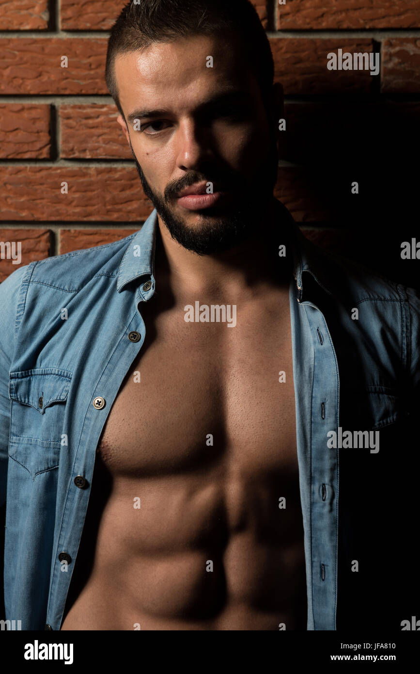 Muscular man in blue pants hi-res stock photography and images - Alamy