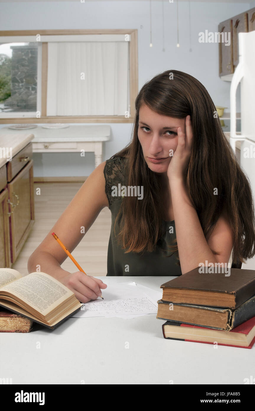 Woman doing homework Stock Photo - Alamy