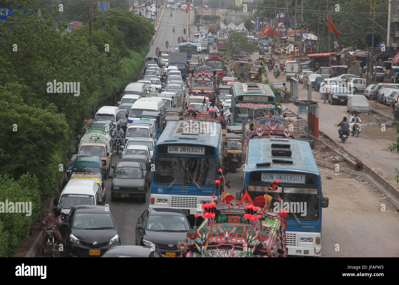 Numbers of motors stuck in traffic jam due to deep sink hole which ...