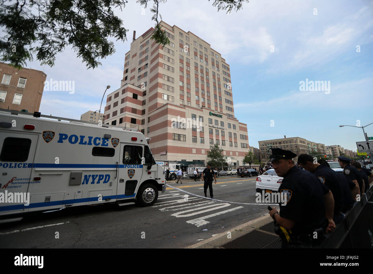 New York, USA. 30th June, 2017. Police officers gather outside Bronx ...