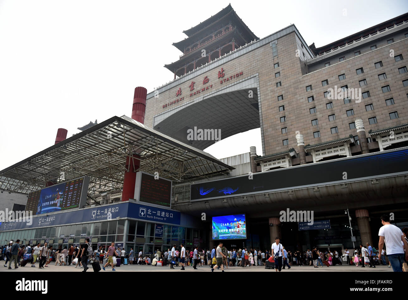 Beijing, China. 1st July, 2017. Passengers walk at Beijing West Railway ...