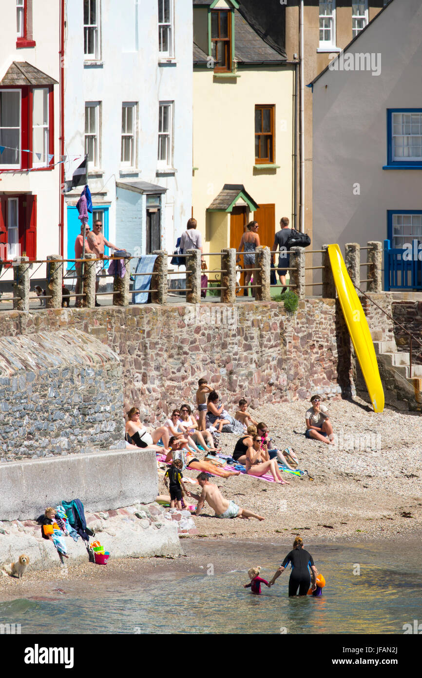 People spending a day at the beach at the popular seaside village of ...