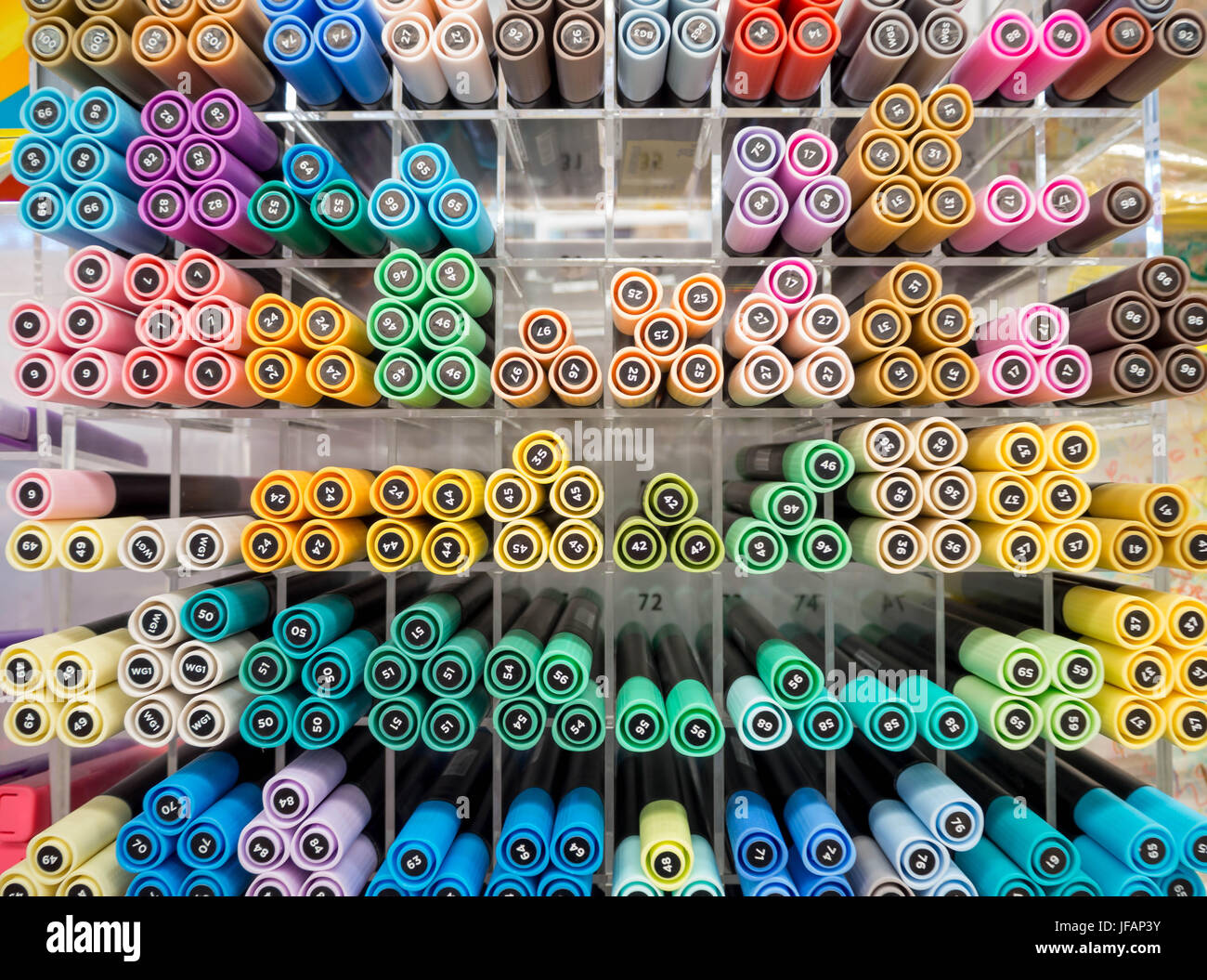 Colorful pens on shelf in stationery store, selective focus Stock Photo ...