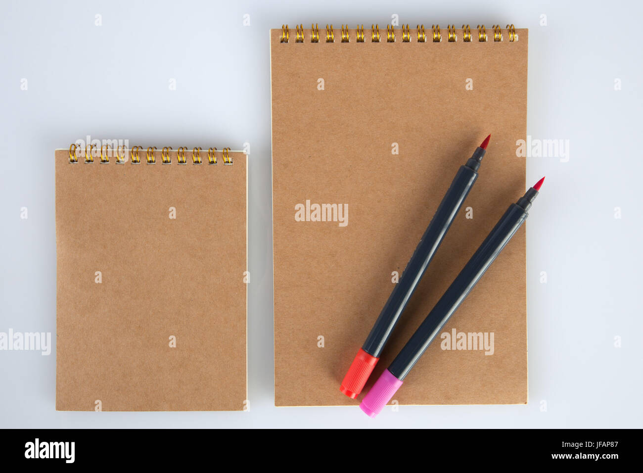 Two spiral notepads big and small with two markers for mockups. Top ...