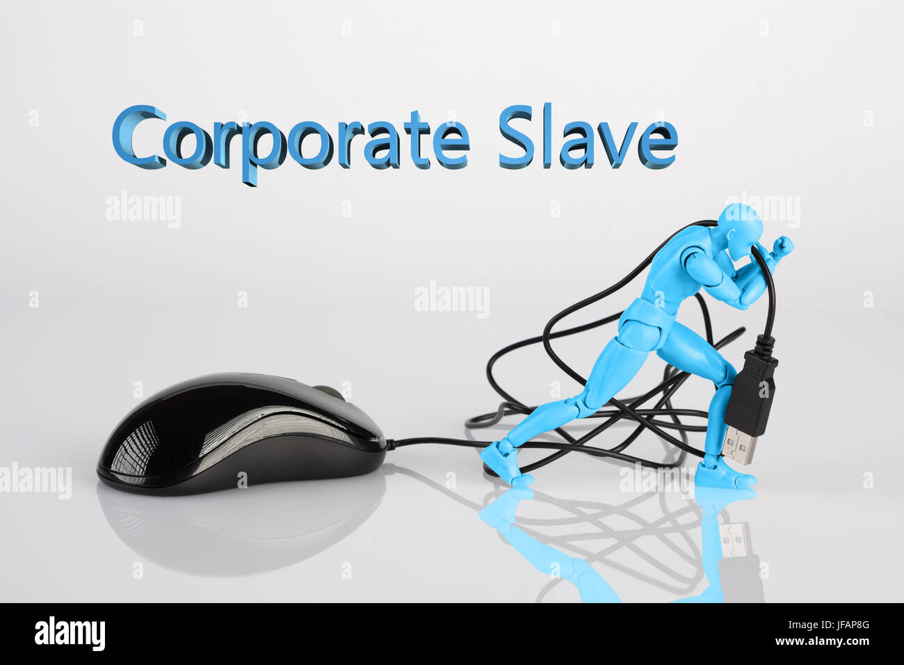Male figurine dragging a computer mouse across white table. Corporate ...