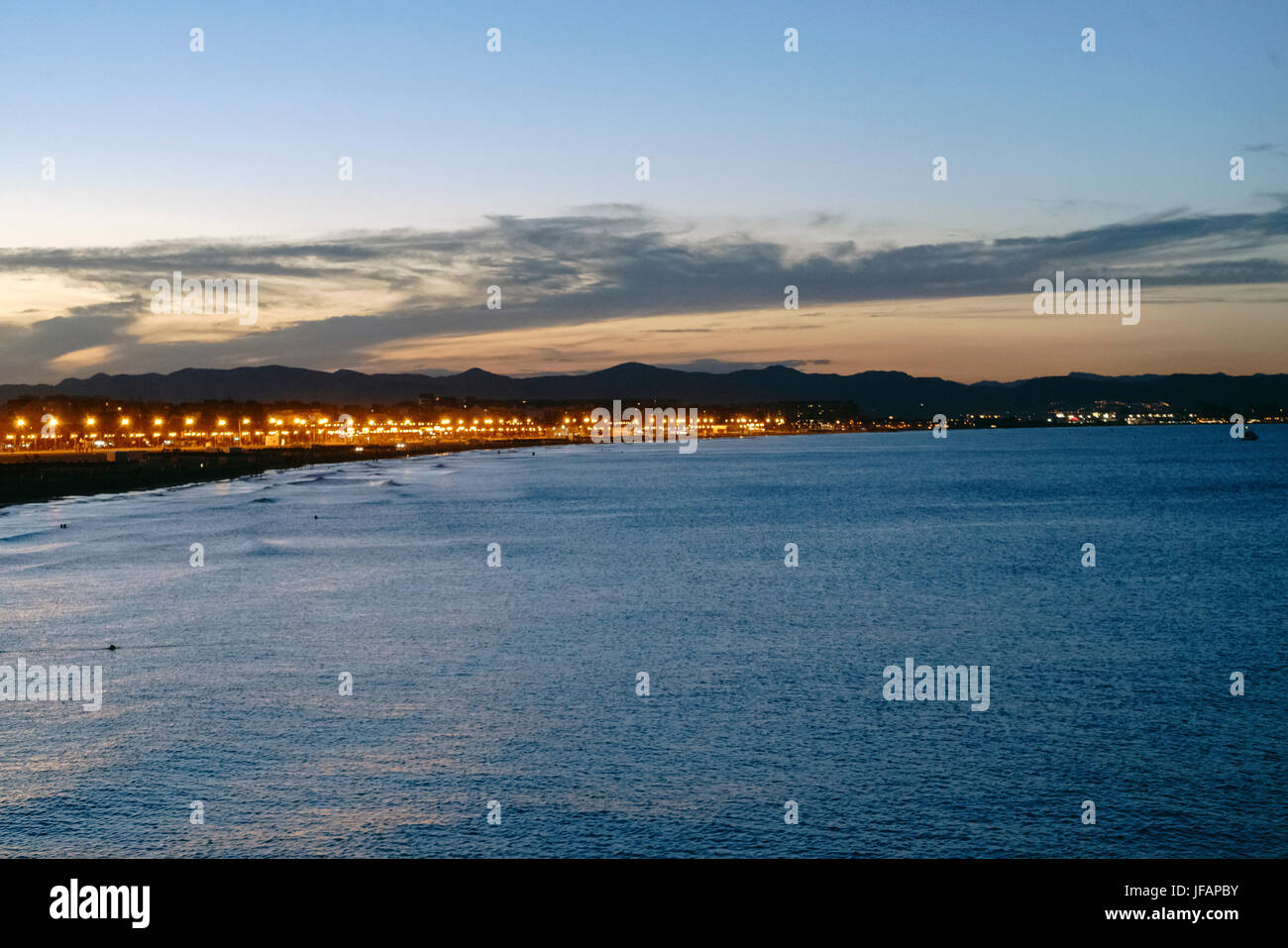 Night view of a Mediterranean beach with illuminated promenade Stock ...