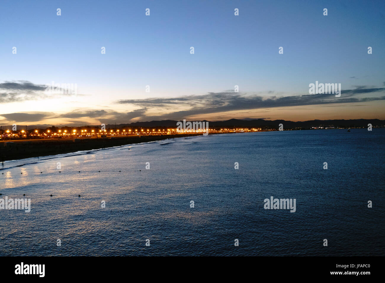 Night view of a Mediterranean beach with illuminated promenade Stock ...