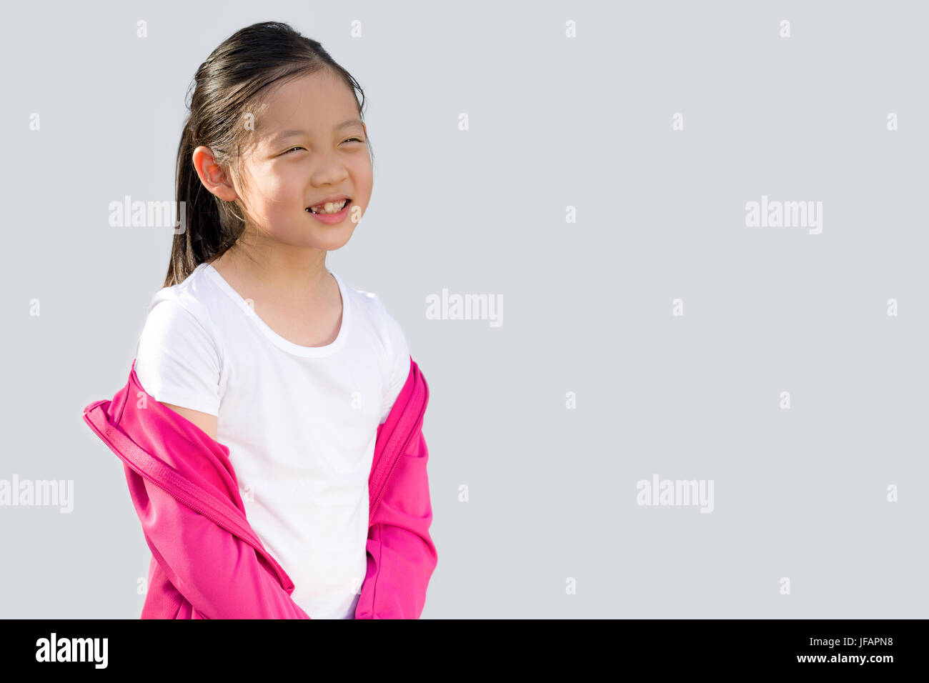 Studio Shot of Asian child in sweater isolated on white background ...