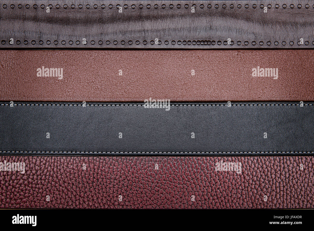 Dark natural leather belts close-up texture background Stock Photo - Alamy