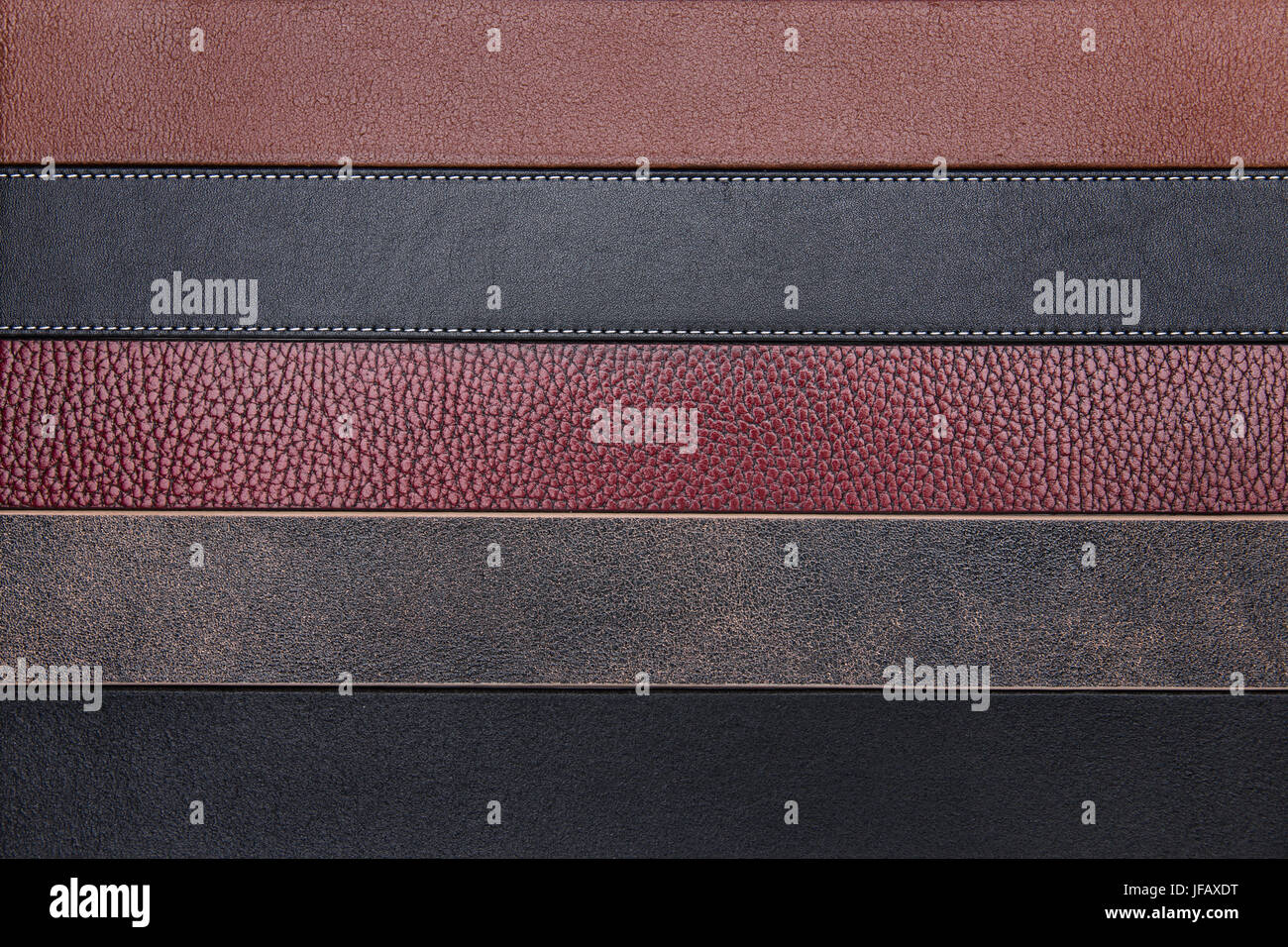 Dark natural leather belts close-up texture background Stock Photo - Alamy
