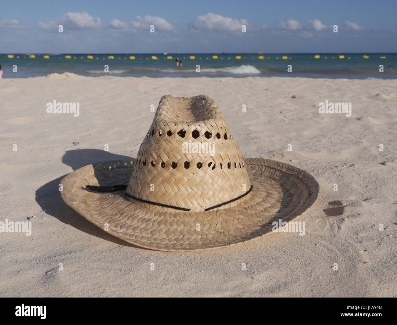 A straw cowboy hat abandoned on the beach Stock Photo - Alamy