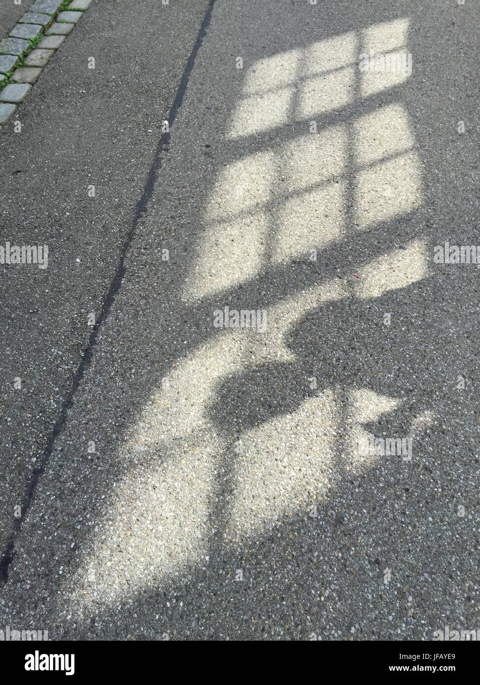 Shadow on ground of person dropped through window bars Stock Photo - Alamy