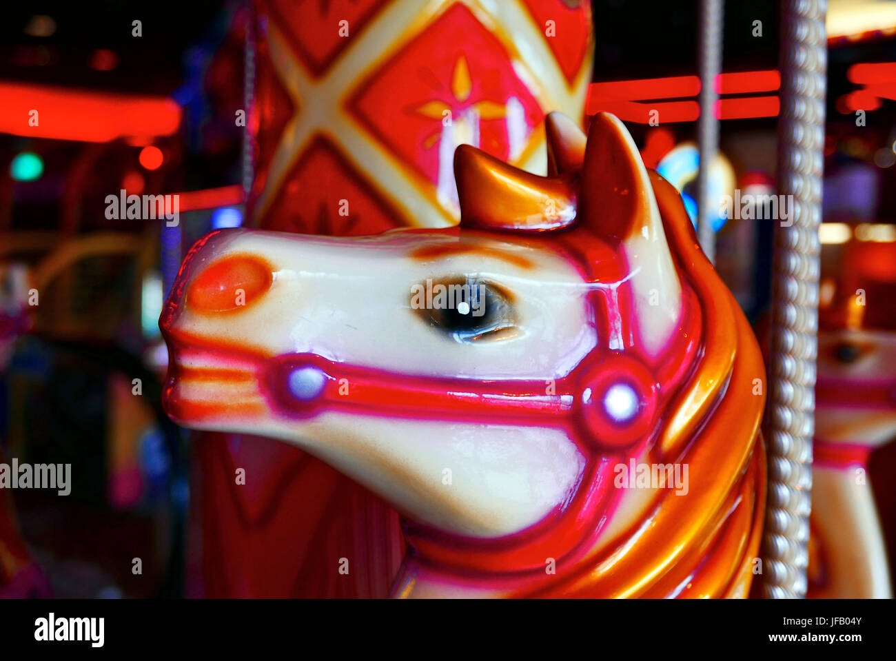 Head of horse on miniature merry go round in amusement arcade Stock ...