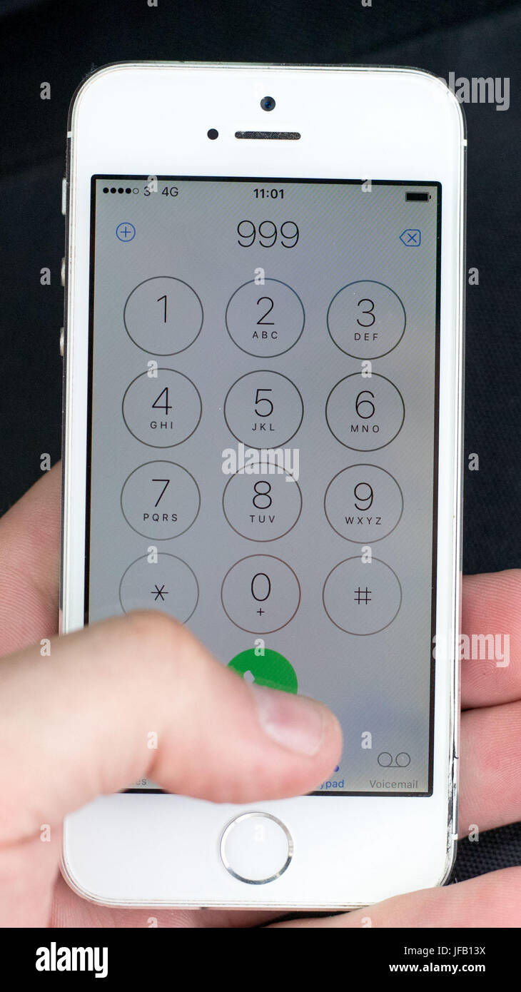 PICTURE POSED BY MODEL A person dials the '999' Emergency number on a ...