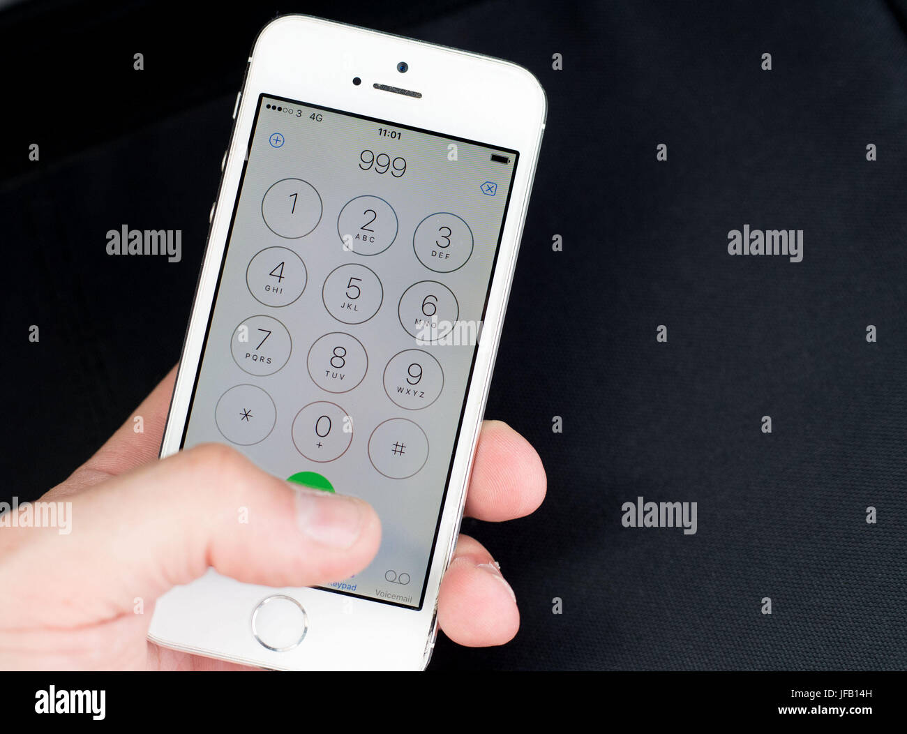 Mobile phone with emergency number 999 hi-res stock photography and ...