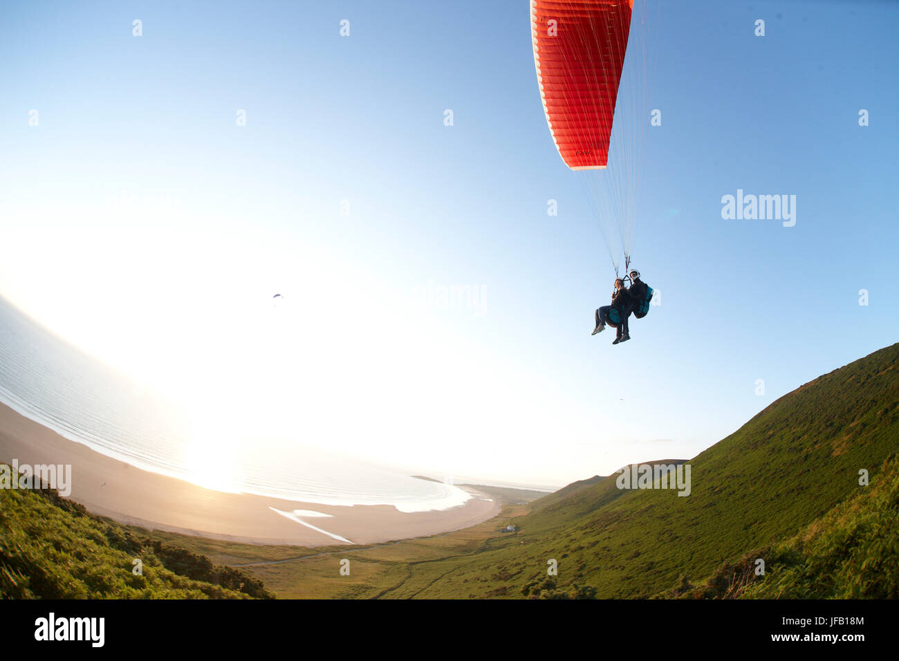 Paragliders paragliding in blue hi-res stock photography and images - Alamy