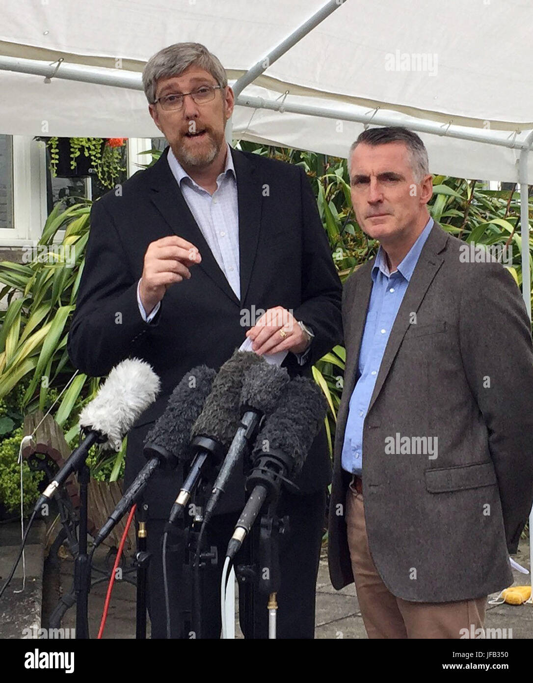 Sinn Fein's John O'Dowd (left) and Declan Kearney speaking to the media ...