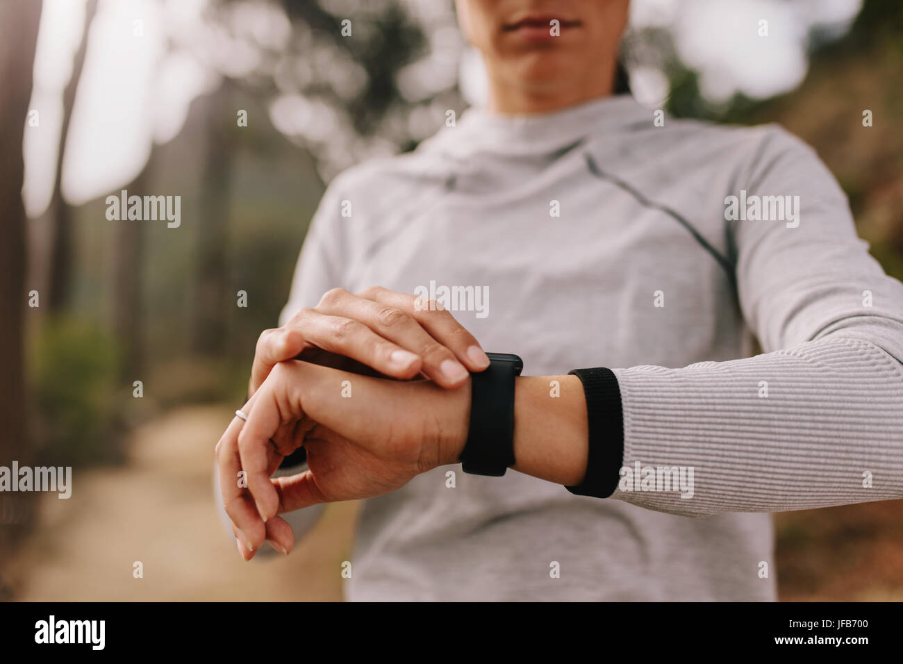Close up of female athlete checking fitness progress on her smart watch ...