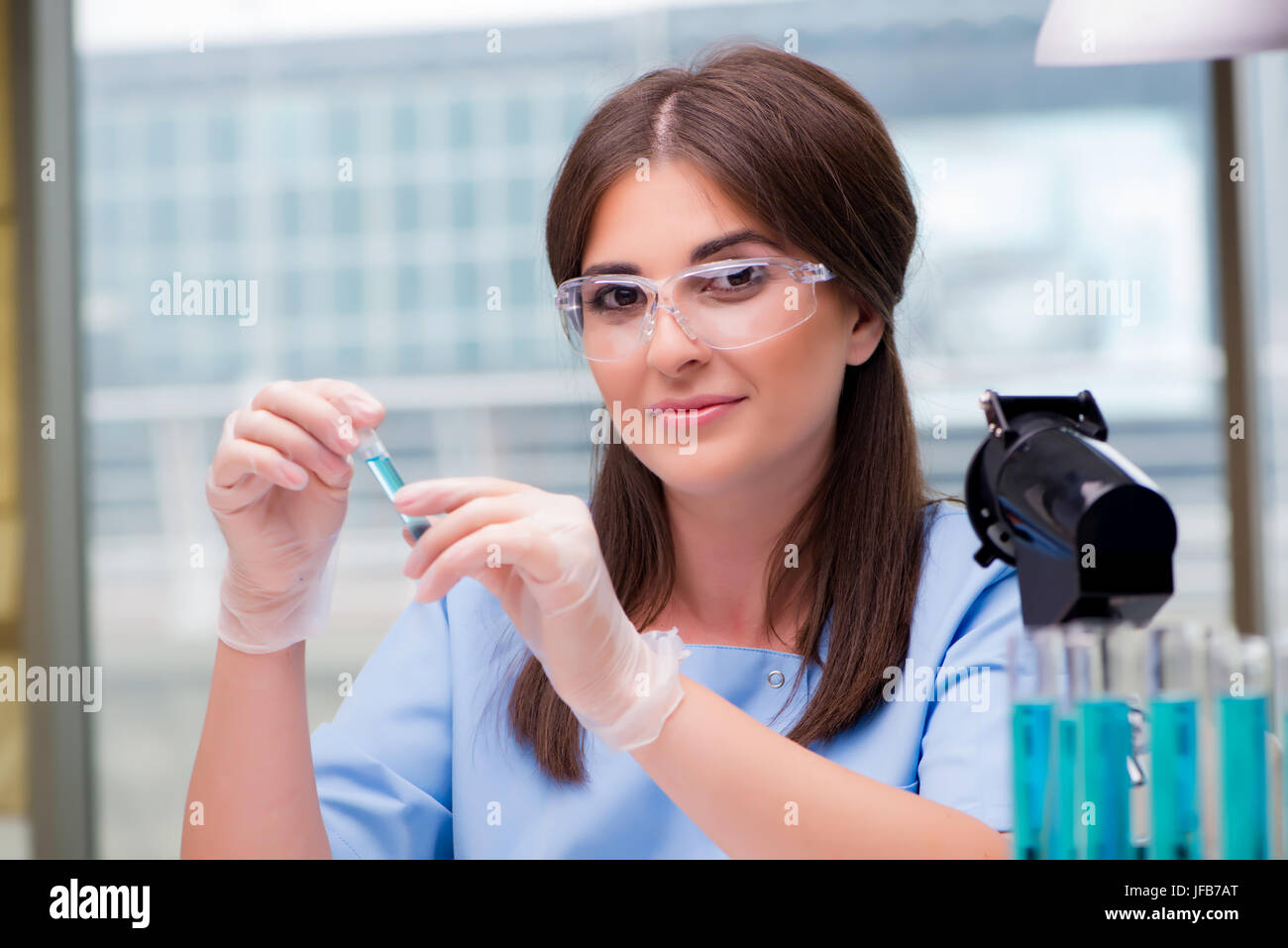 Young woman working in the laboratory Stock Photo - Alamy