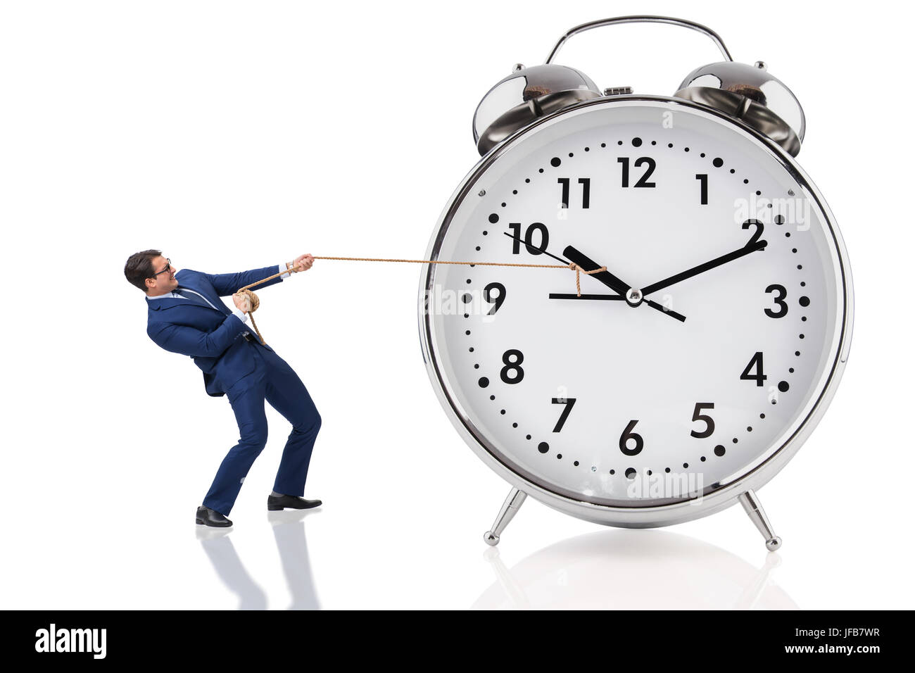 Businessman pulling clock in time concept Stock Photo - Alamy