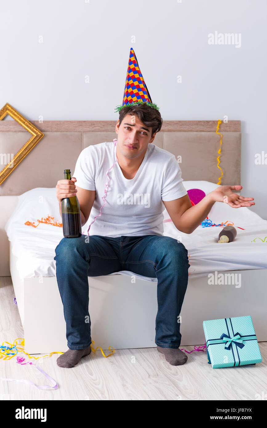 Man after heavy christmas partying at home Stock Photo - Alamy