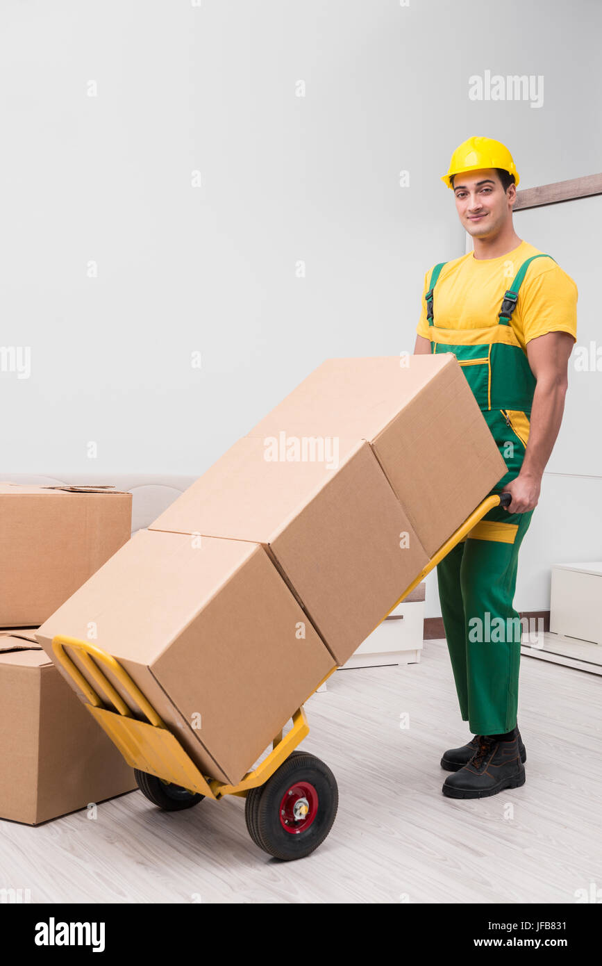 Man delivering boxes during house move Stock Photo - Alamy