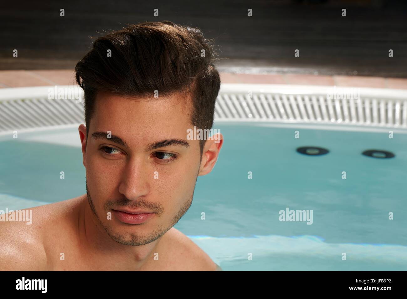 Young man in a whirlpool Stock Photo - Alamy