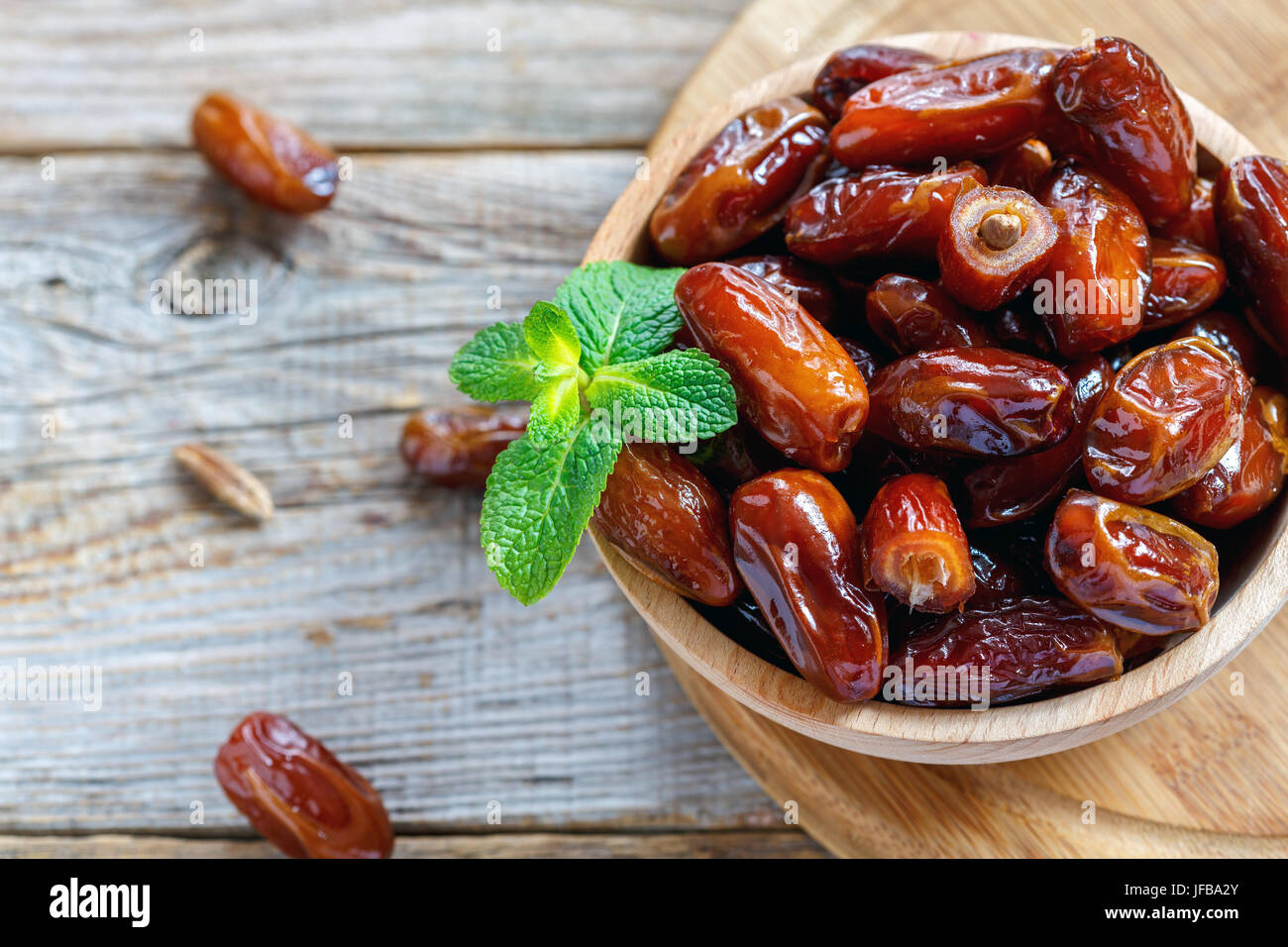 Delicious dried date and green mint close up Stock Photo - Alamy