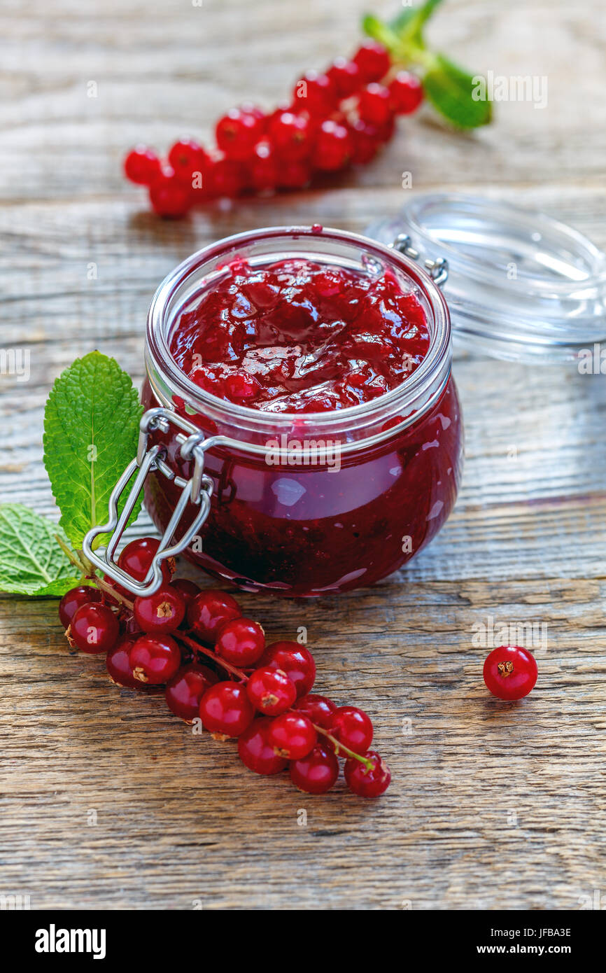 Jam of red currants in a jar Stock Photo - Alamy
