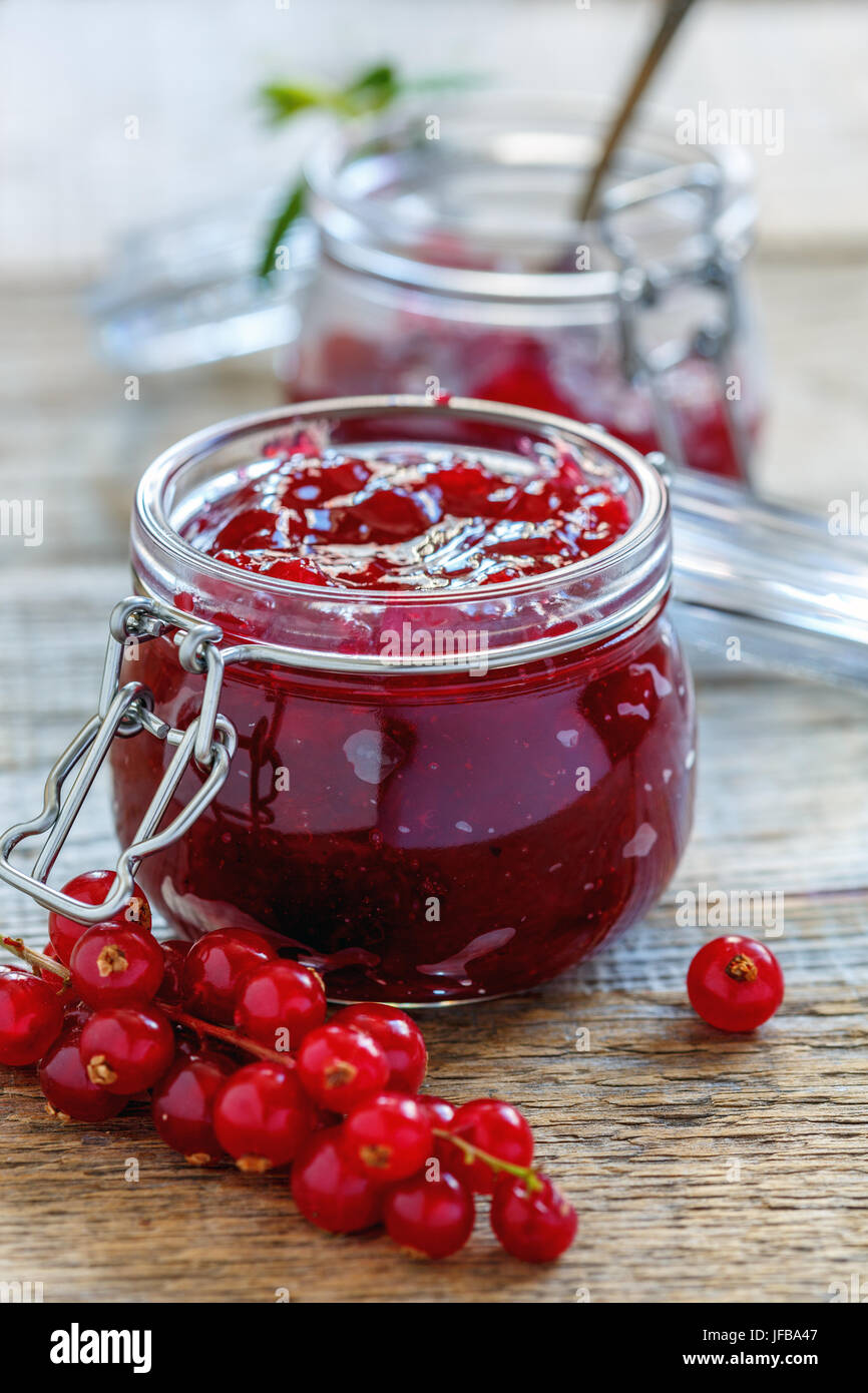 Homemade jam of red currants in a glass jar Stock Photo - Alamy