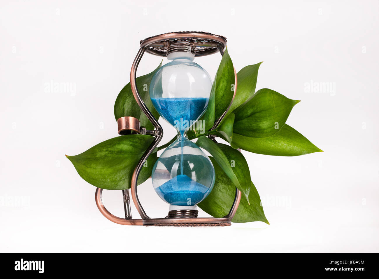 Sandglass With Leaves Stock Photo - Alamy