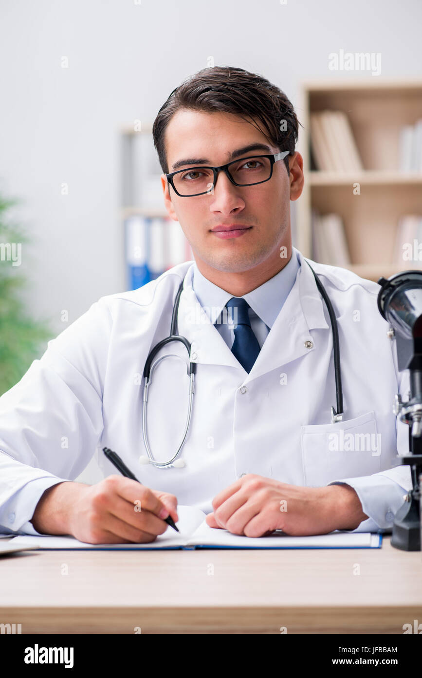 Young adult doctor working in the hospital Stock Photo - Alamy