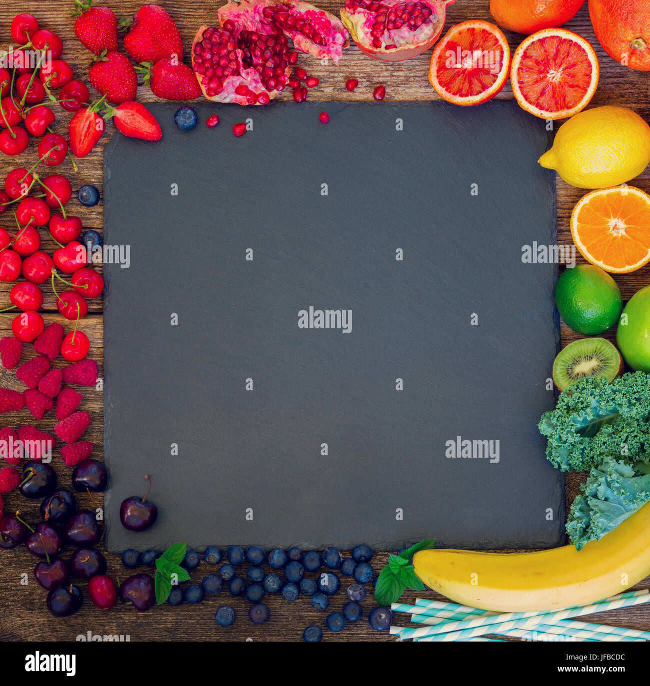 Fresh fruits and berries summer food frame with copy space, retro toned ...