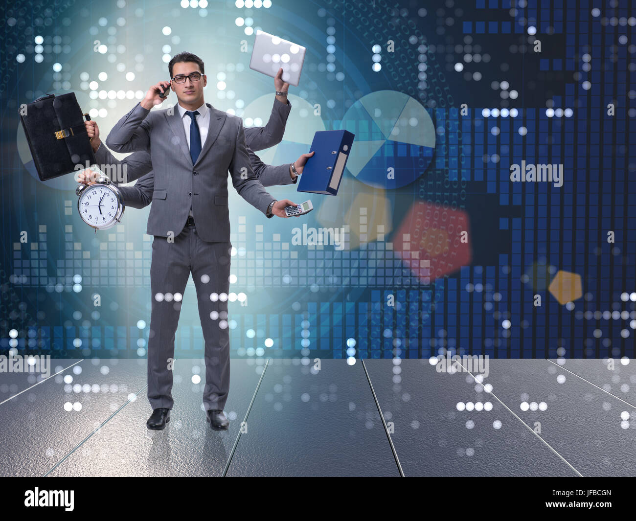Young businessman in multitasking concept Stock Photo - Alamy