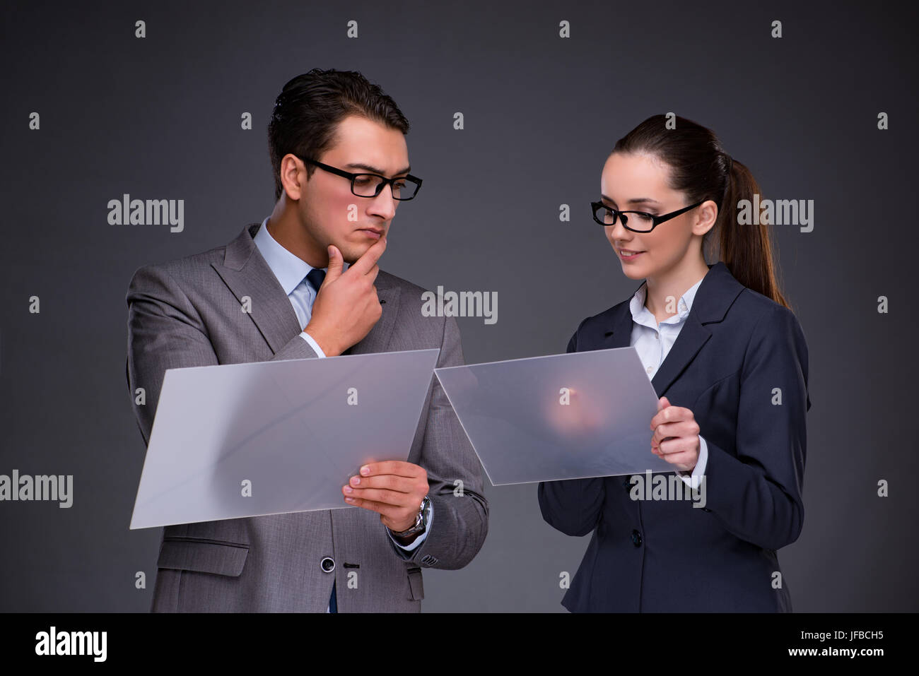 Businesspeople working on virtual screen Stock Photo - Alamy