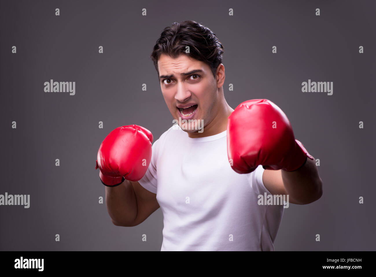 Handsome boxer in boxing concept Stock Photo - Alamy