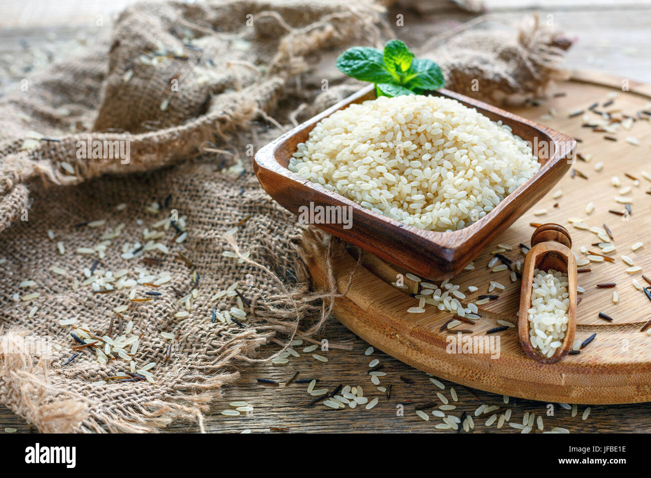 White round rice in a wooden bowl Stock Photo - Alamy