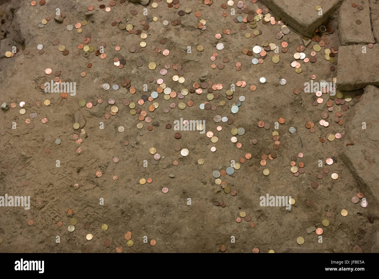 Pennies in the ground Stock Photo - Alamy