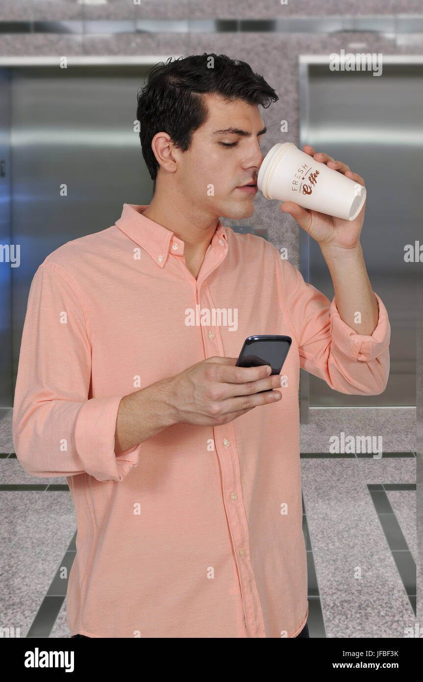 Man on the phone with coffee Stock Photo - Alamy