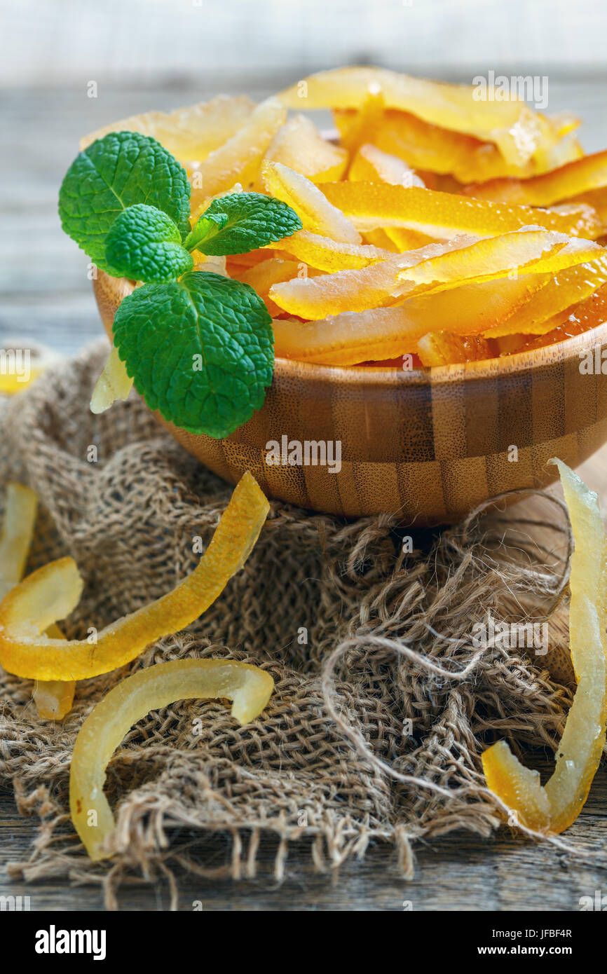Delicious candied citrus fruit and a sprig of mint Stock Photo - Alamy