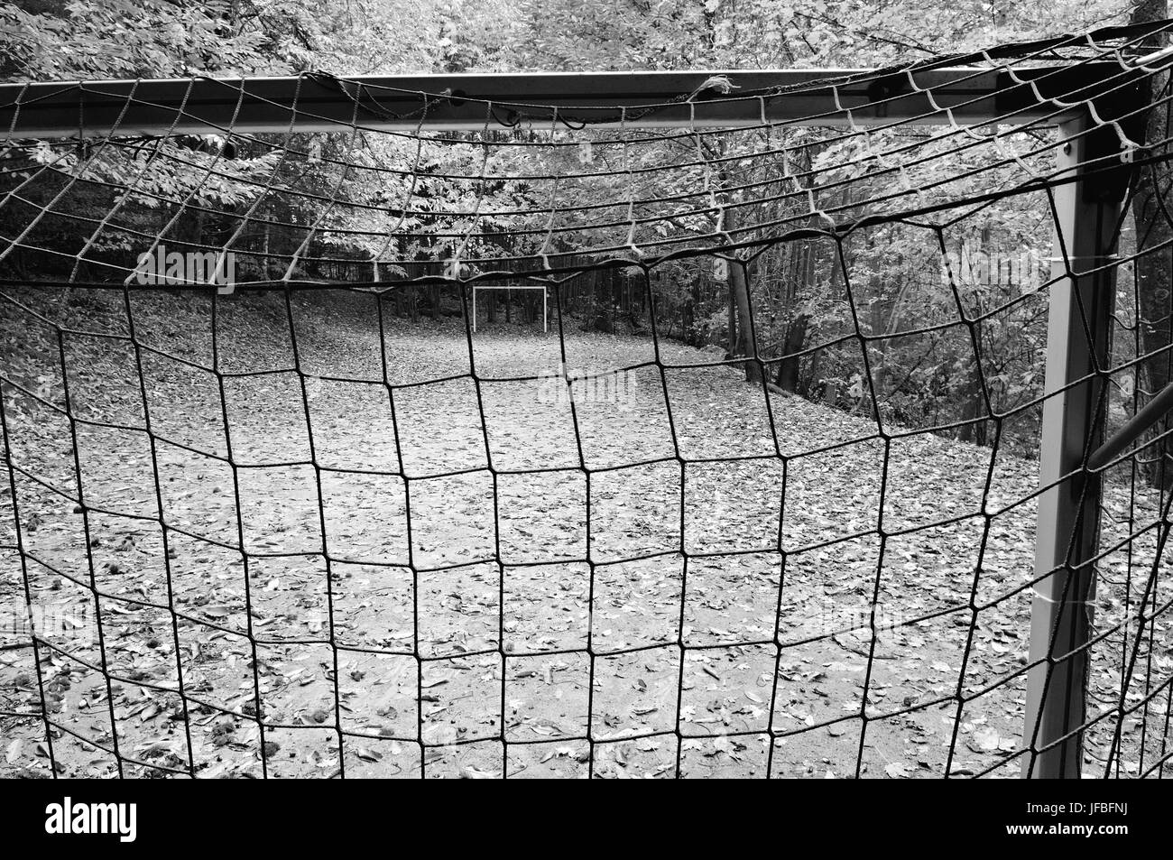 Children playing football in field Black and White Stock Photos ...
