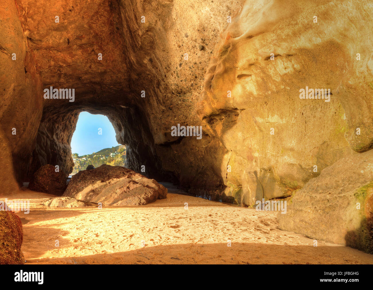 Open cave at One Thousand Steps Beach Stock Photo - Alamy