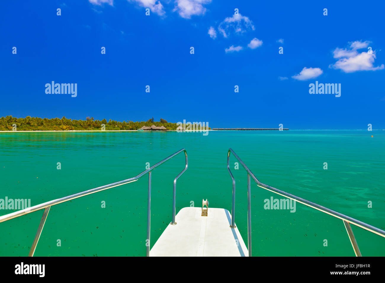 Tropical island and boat Stock Photo - Alamy
