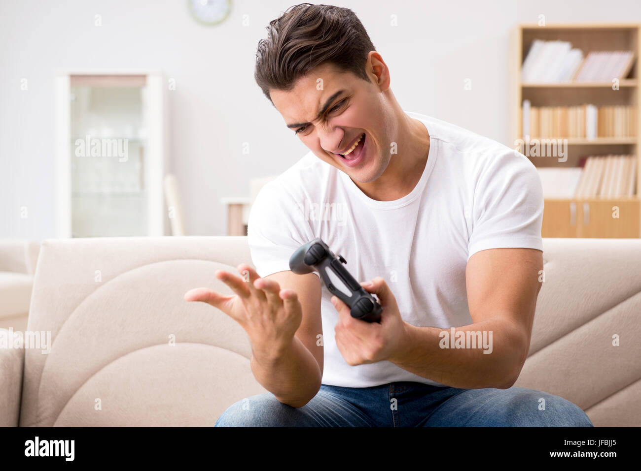 Man addicted to computer games Stock Photo - Alamy