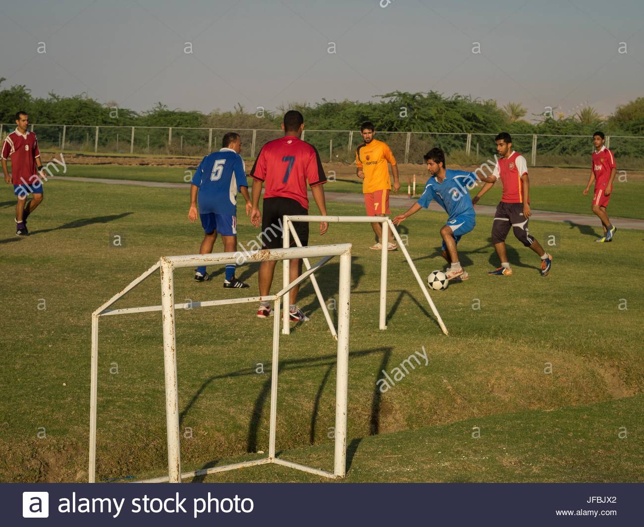 Boys Playing Football In The Street Stock Photos & Boys Playing ...