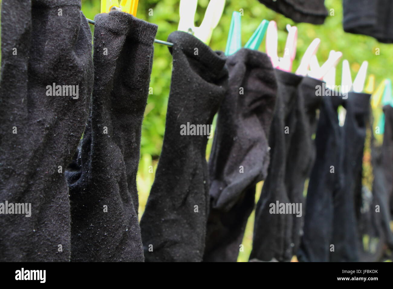 Washing line with socks Stock Photo - Alamy
