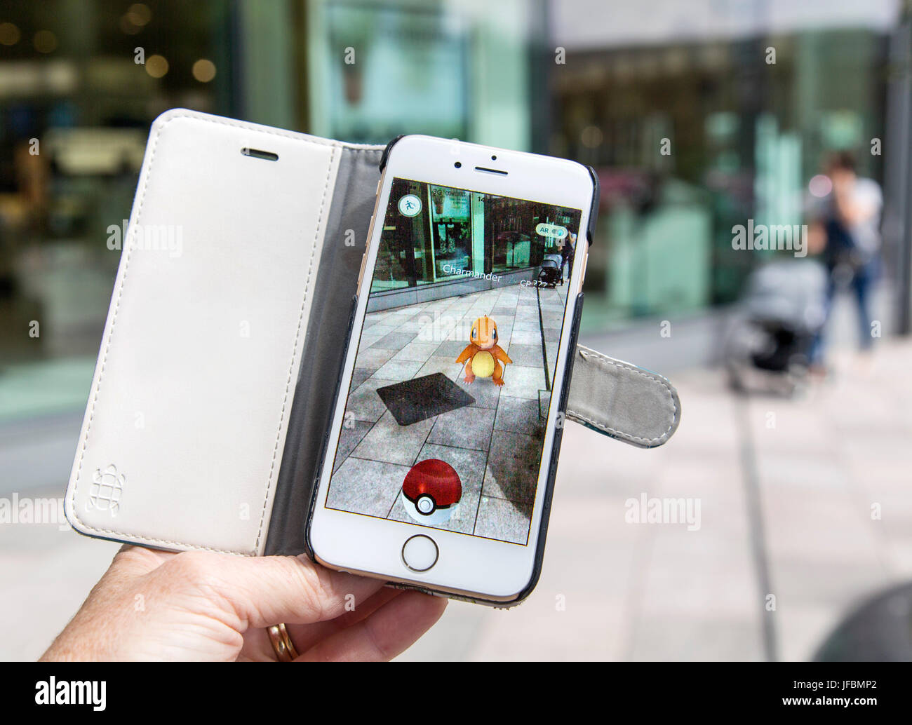Playing Pokemon Go on the Street Stock Photo - Alamy